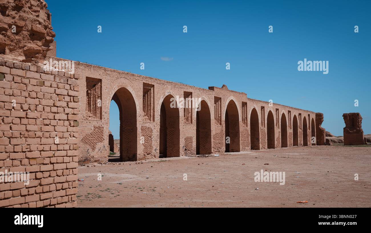 Ancient stone structure with arches stands in Abu Dulaf Iraq showcasing ...