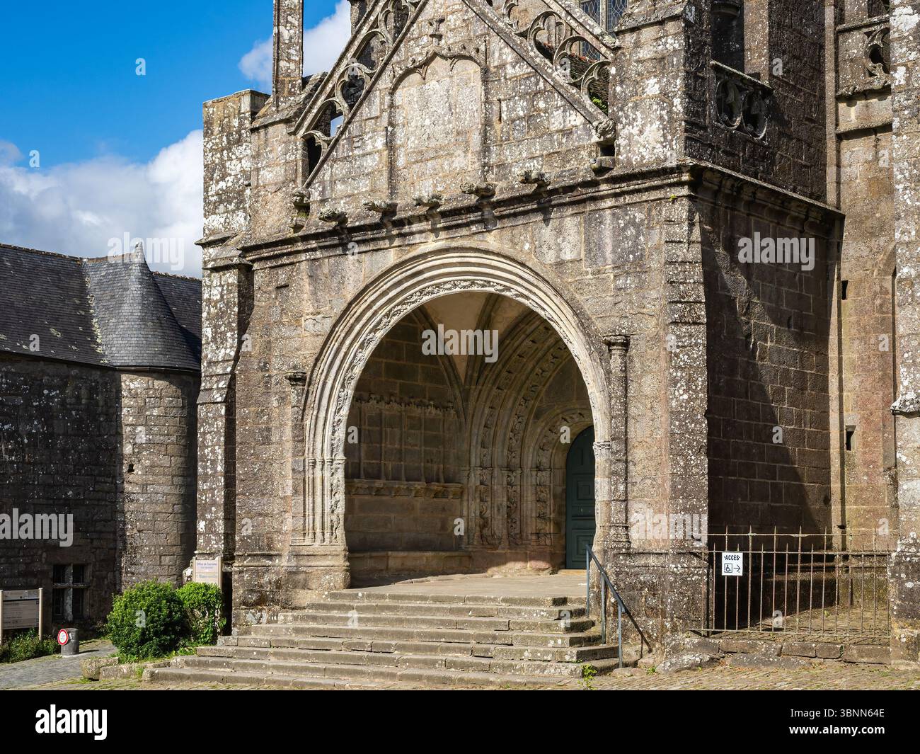 Locronan, France – May 21, 2025: Close-up view of the arched stone ...
