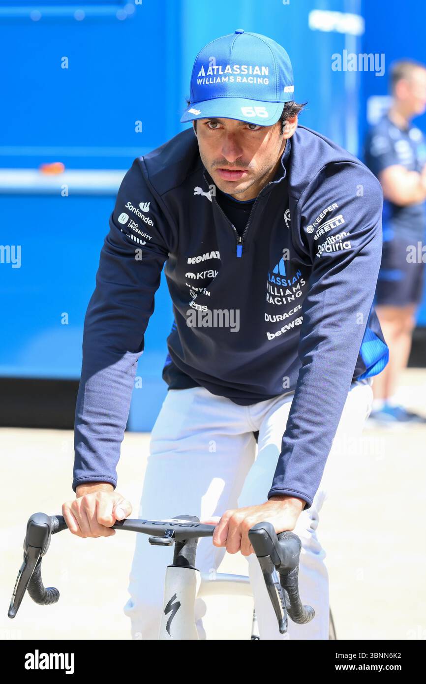 Carlos Sainz of Spain and Williams Mercedes arrives on a bike during the driver arrivals for the ...