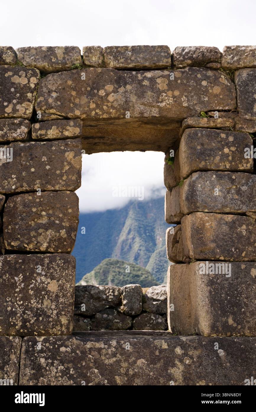 View through a window in a stone building at Machu Picchu, the 15th ...