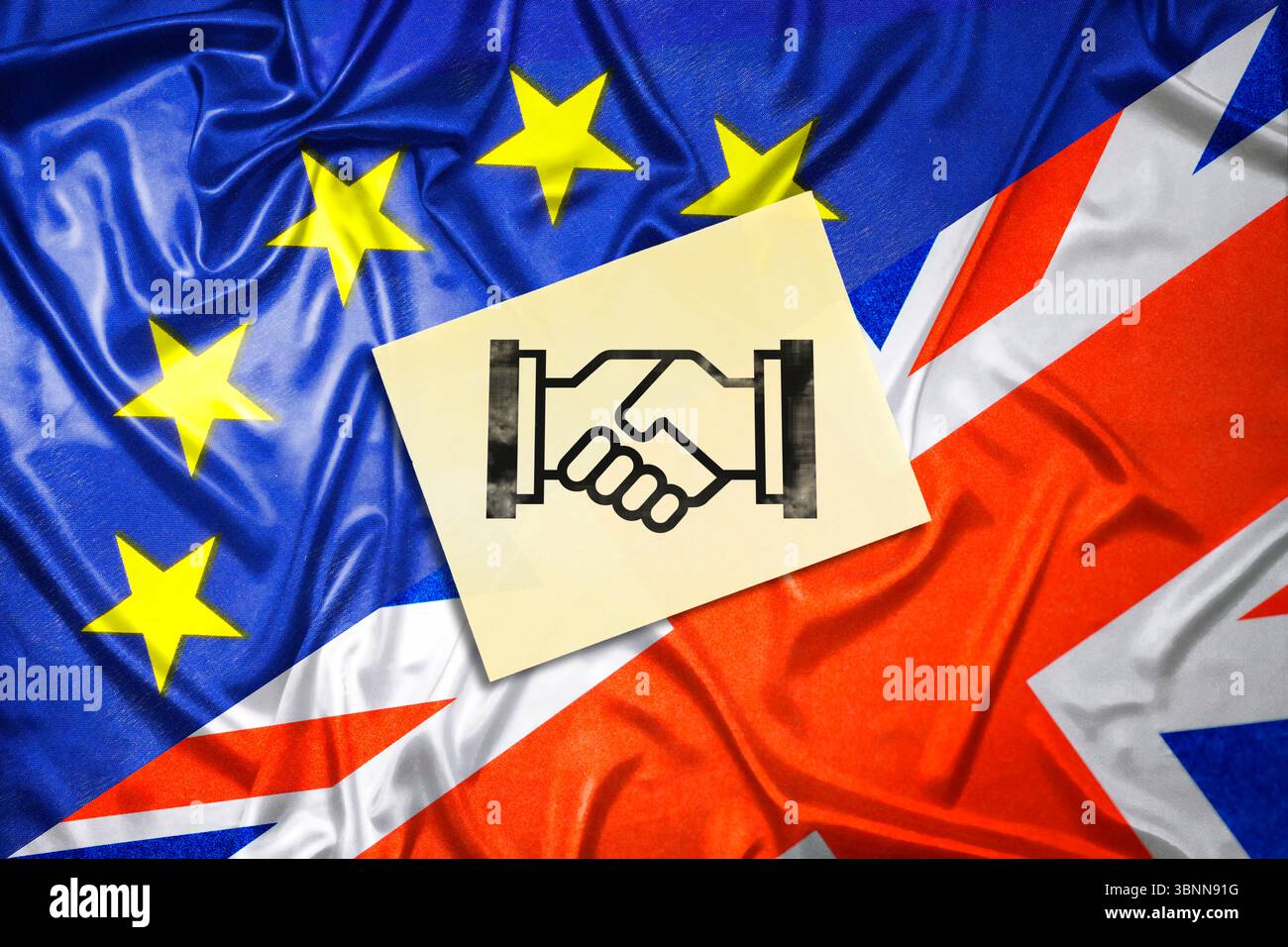 EU and UK flags with note and handshake symbol, symbolic photo for ...