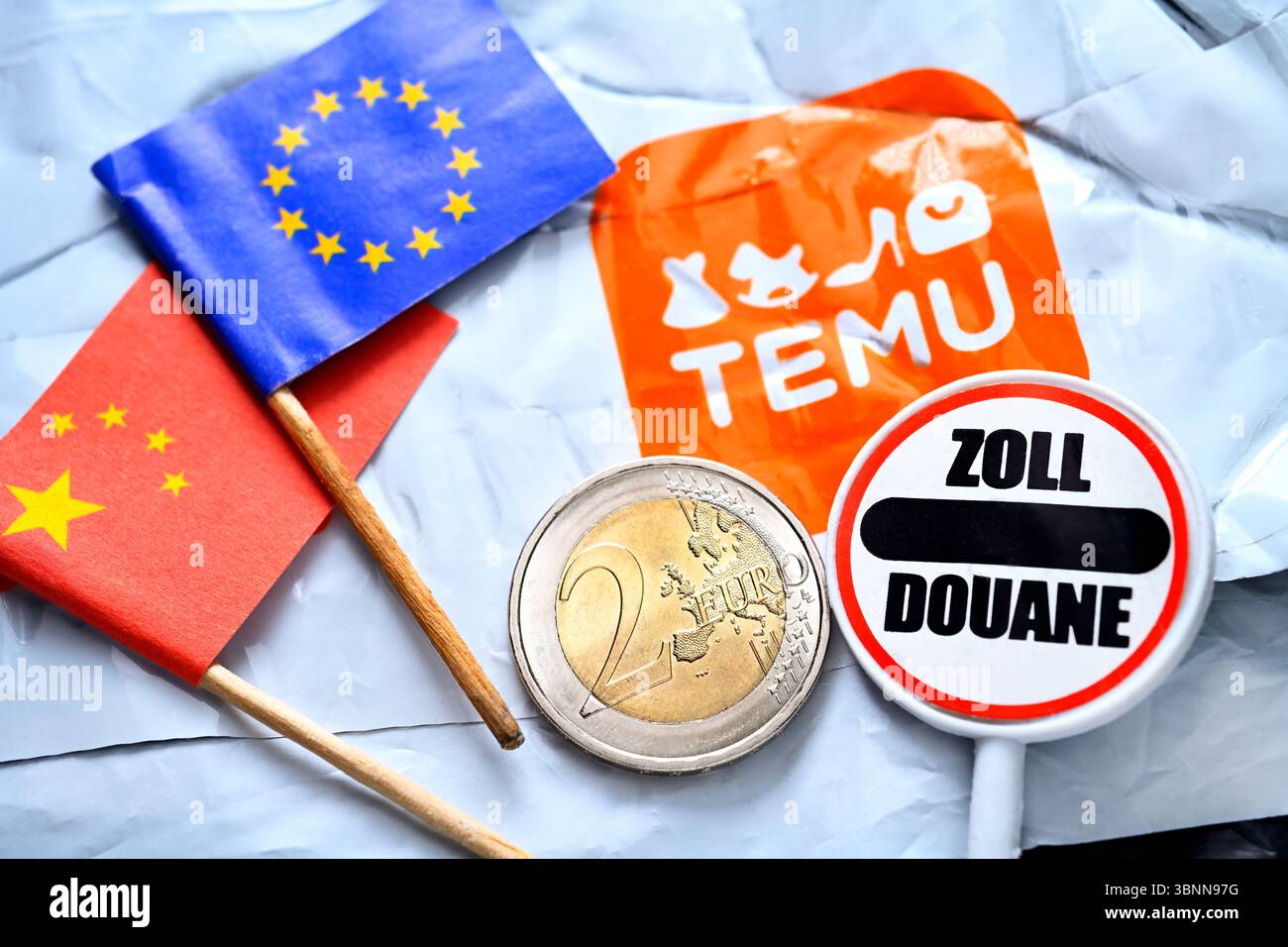 Temu shipment with customs sign and two-euro coin, customs duty levied ...