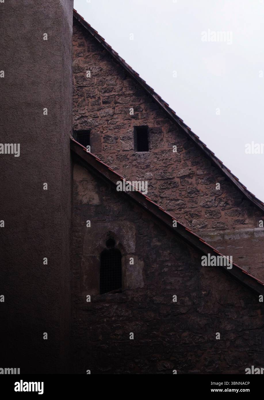 Two gables of a church building on a long chimney stack, windows Stock ...