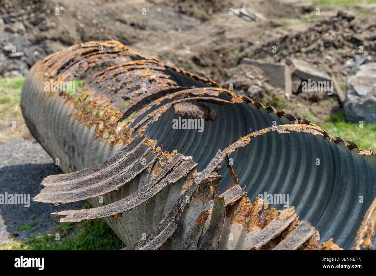 Infrastructure photo of rusted out corrugated metal pipe, CMP, drainage ...