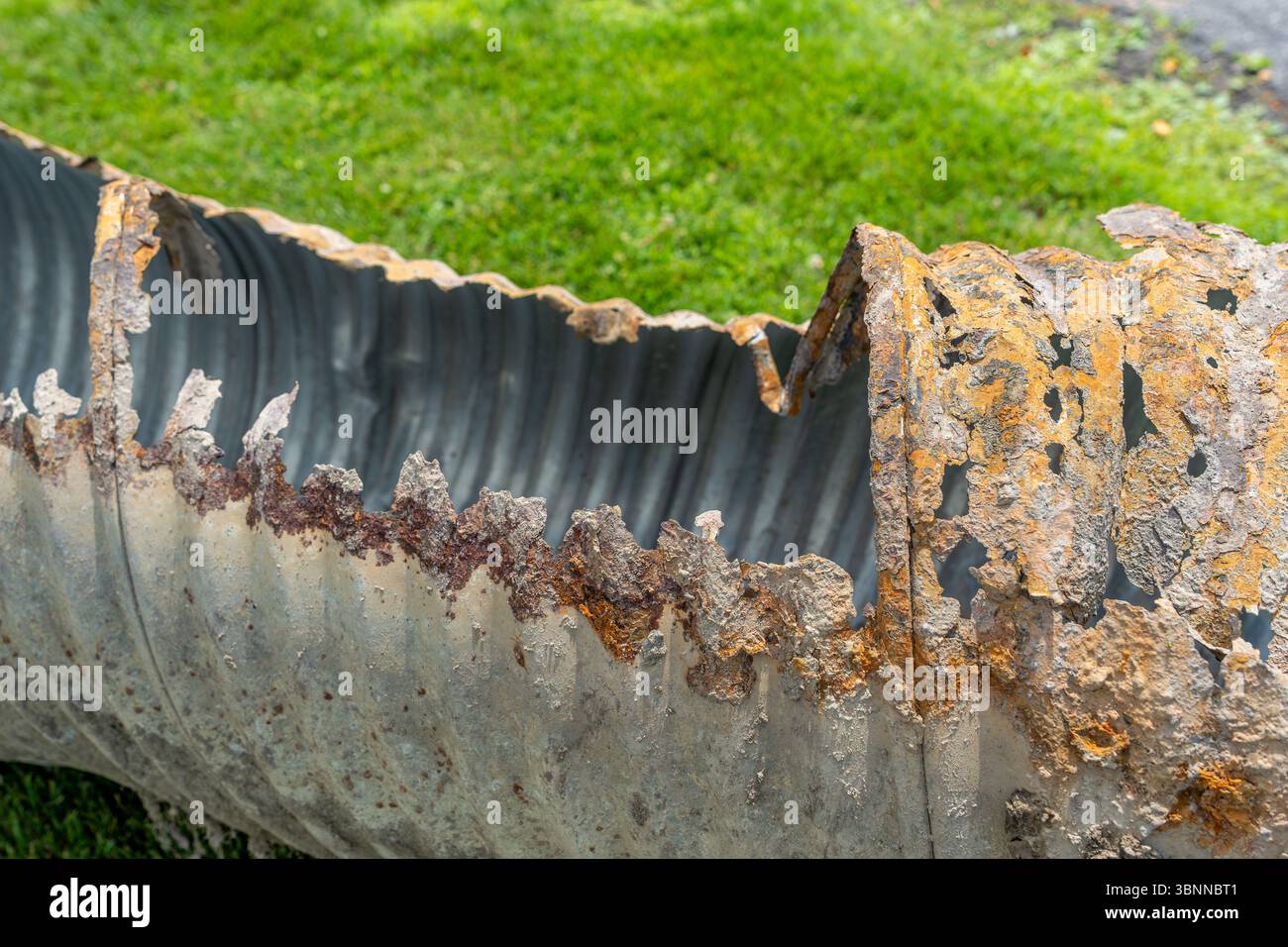 Infrastructure photo of rusted out corrugated metal pipe, CMP, drainage ...