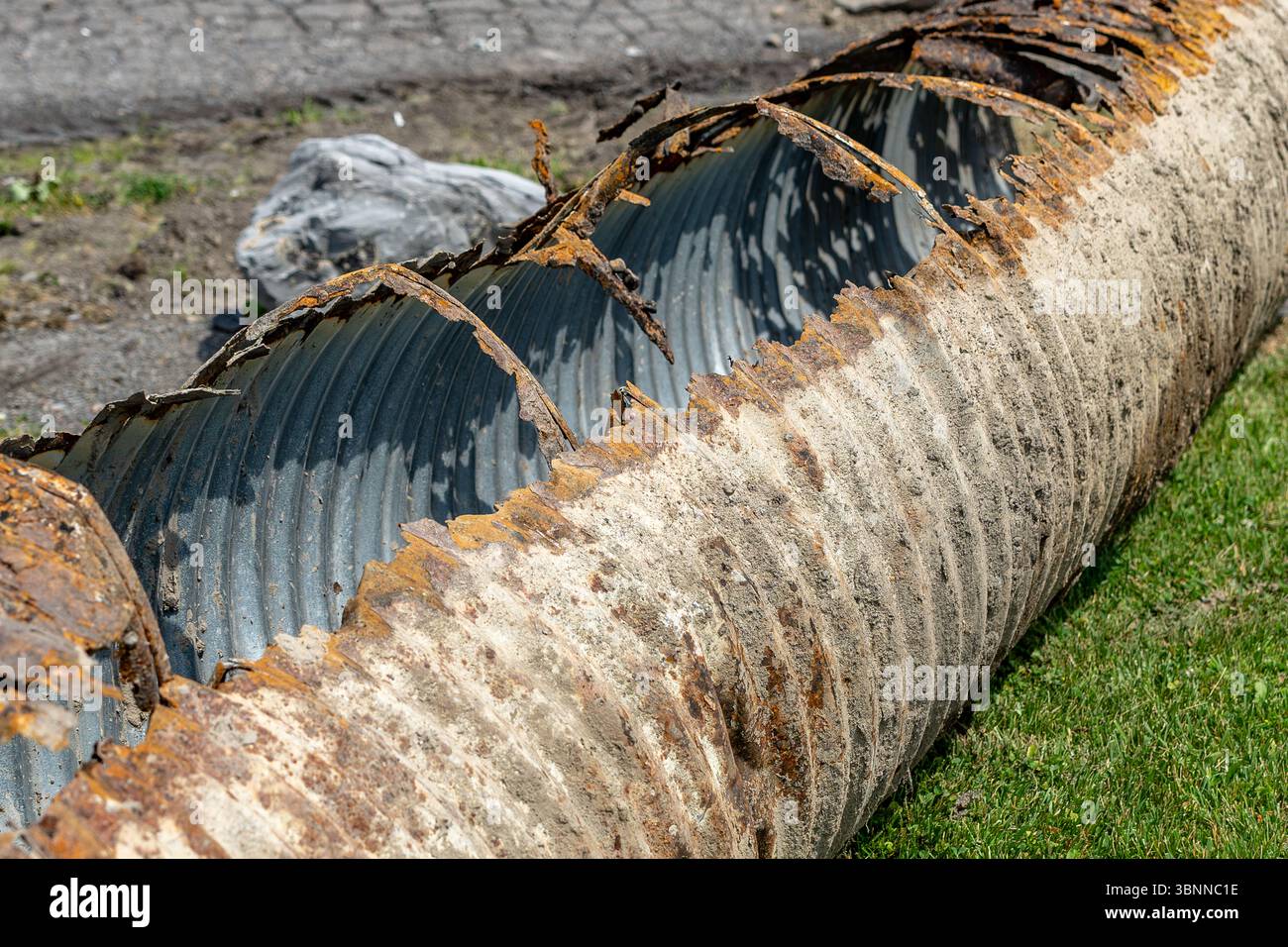 Infrastructure photo of rusted out corrugated metal pipe, CMP, drainage ...