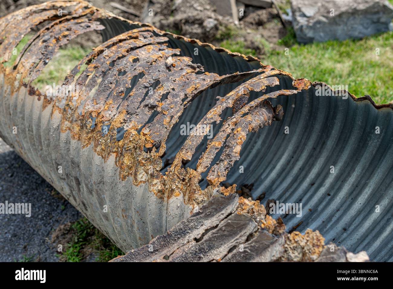 Infrastructure photo of rusted out corrugated metal pipe, CMP, drainage ...