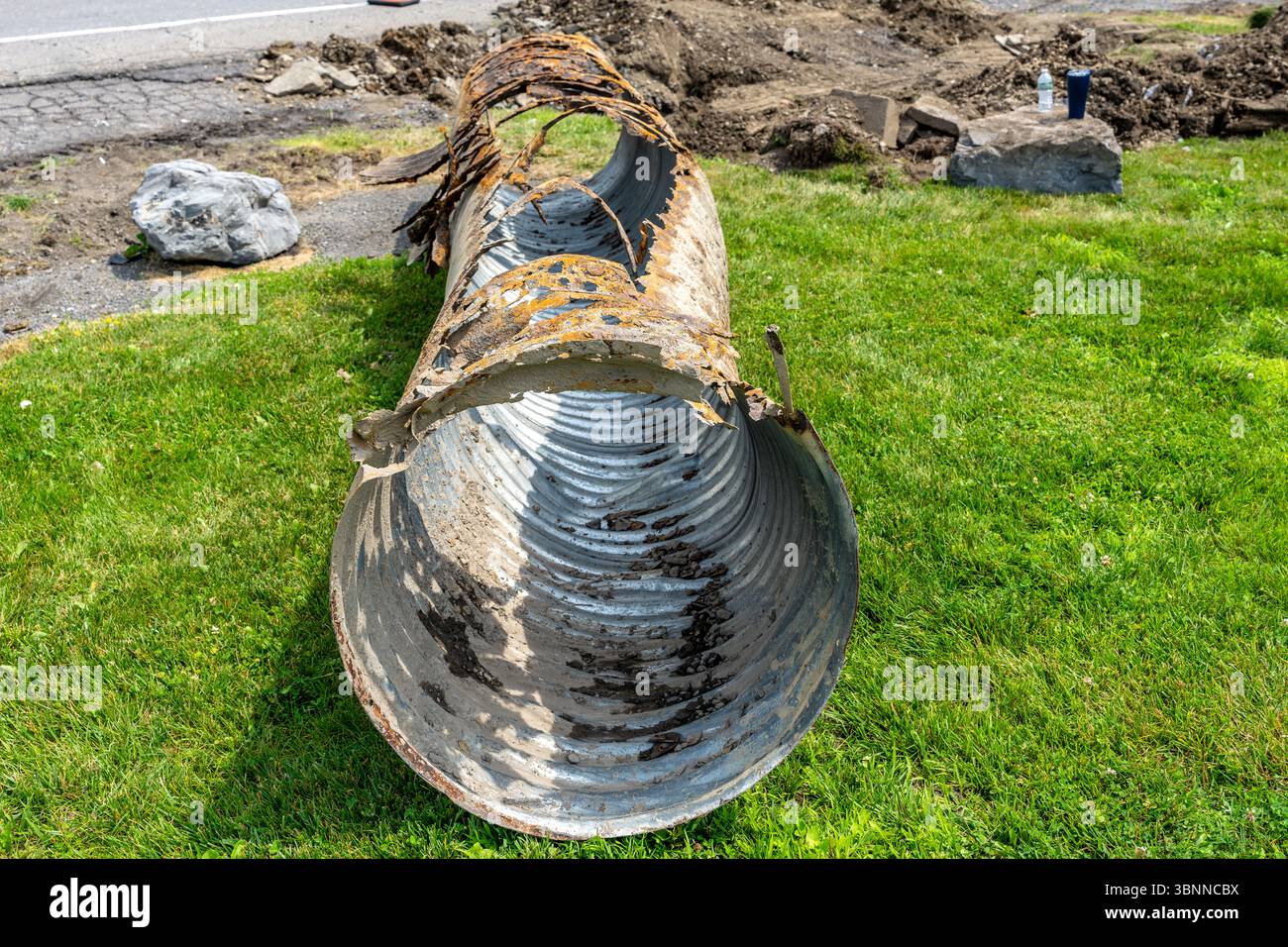 Infrastructure photo of rusted out corrugated metal pipe, CMP, drainage ...