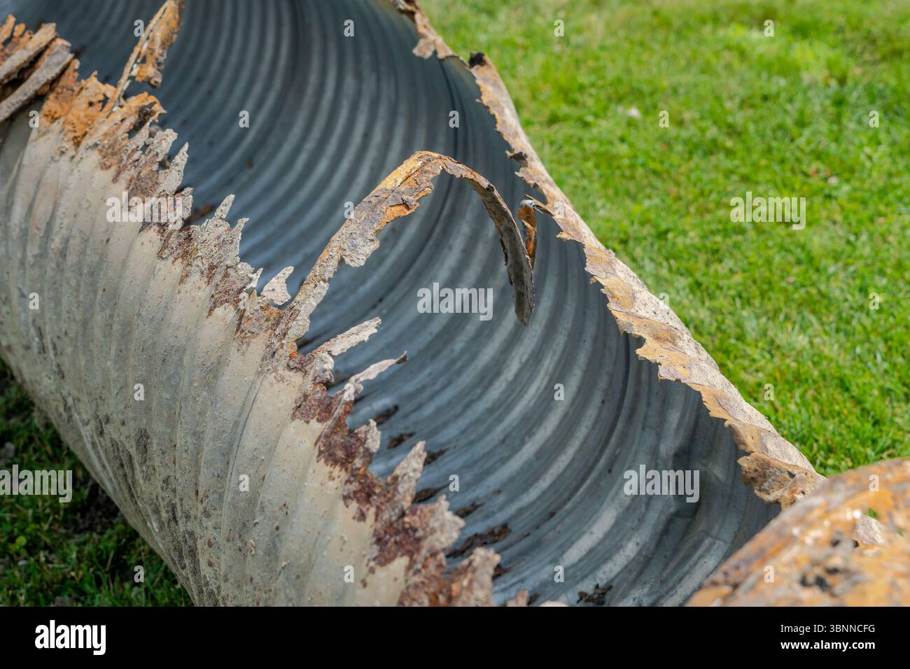 Infrastructure photo of rusted out corrugated metal pipe, CMP, drainage ...