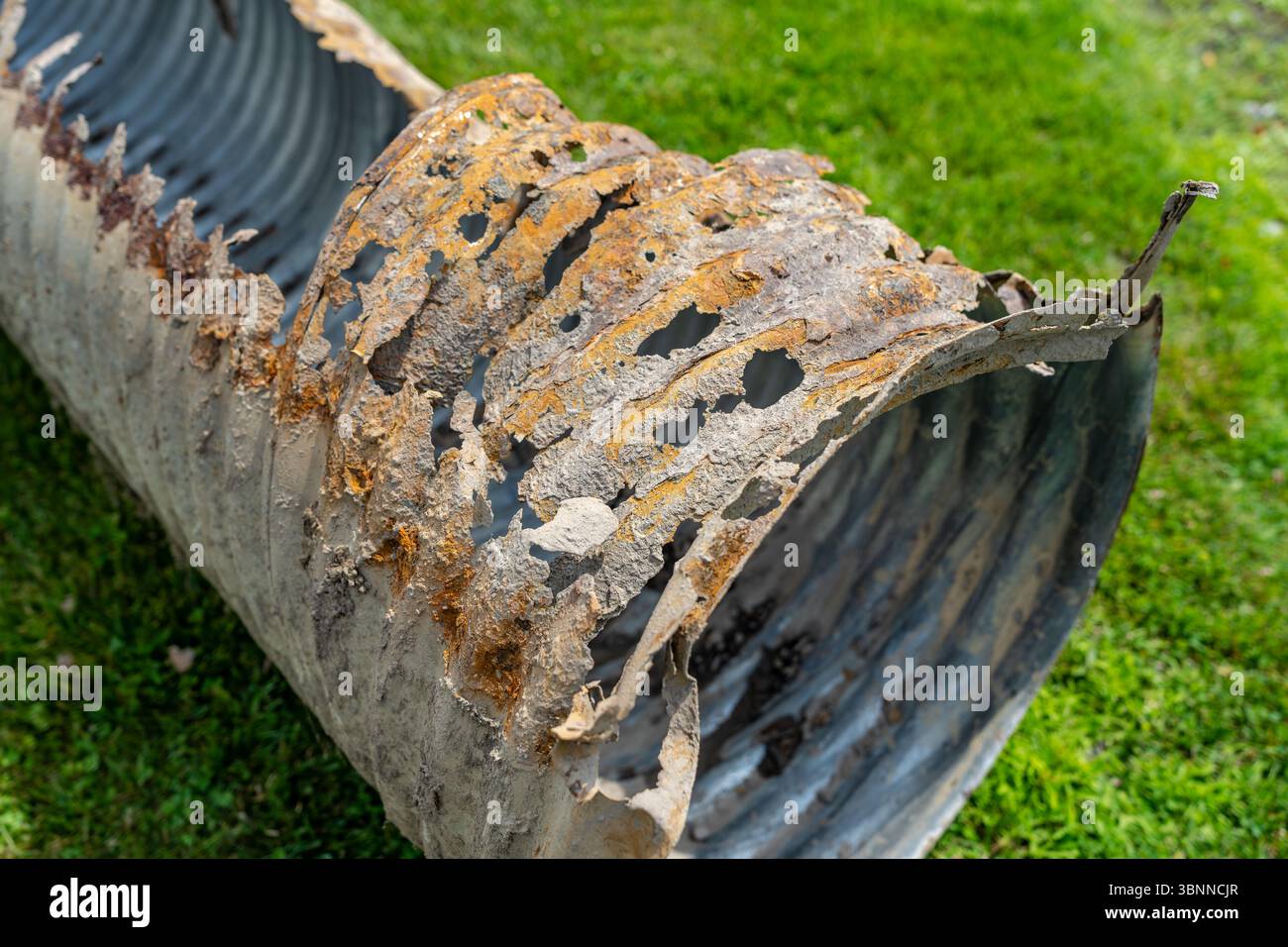 Infrastructure photo of rusted out corrugated metal pipe, CMP, drainage ...