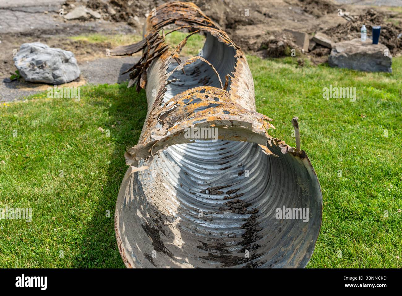 Infrastructure photo of rusted out corrugated metal pipe, CMP, drainage ...