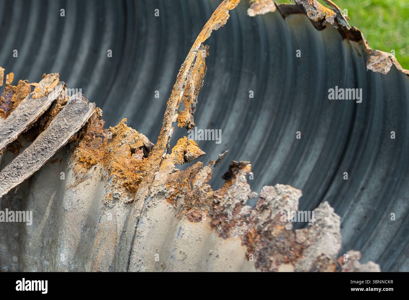 Infrastructure photo of rusted out corrugated metal pipe, CMP, drainage ...