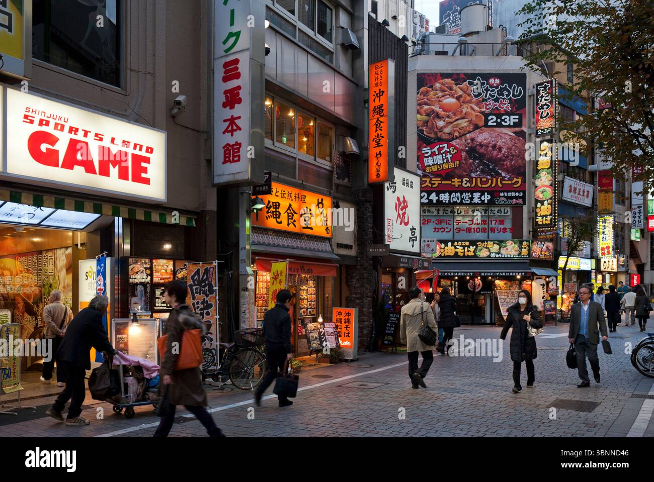 Kabukicho building facades glow in the night with neon signs, the ...