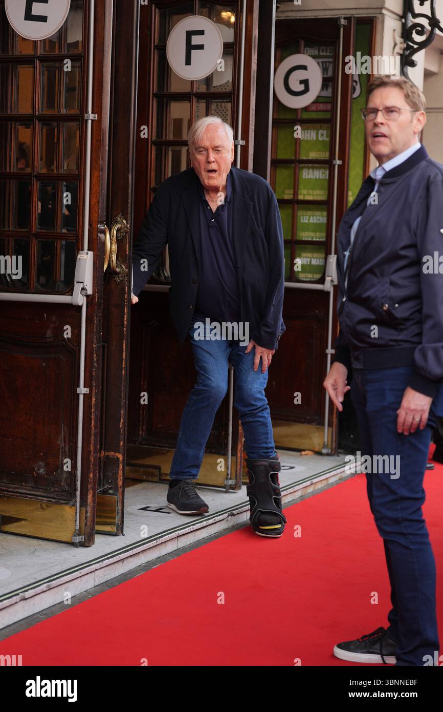 John Cleese jokes around on the red carpet, as he attends a gala night ...