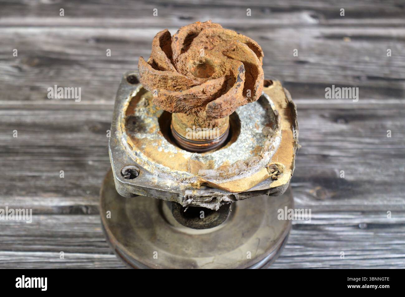 a used old rusty car water pump, water pump is vital to a car engine’s ...