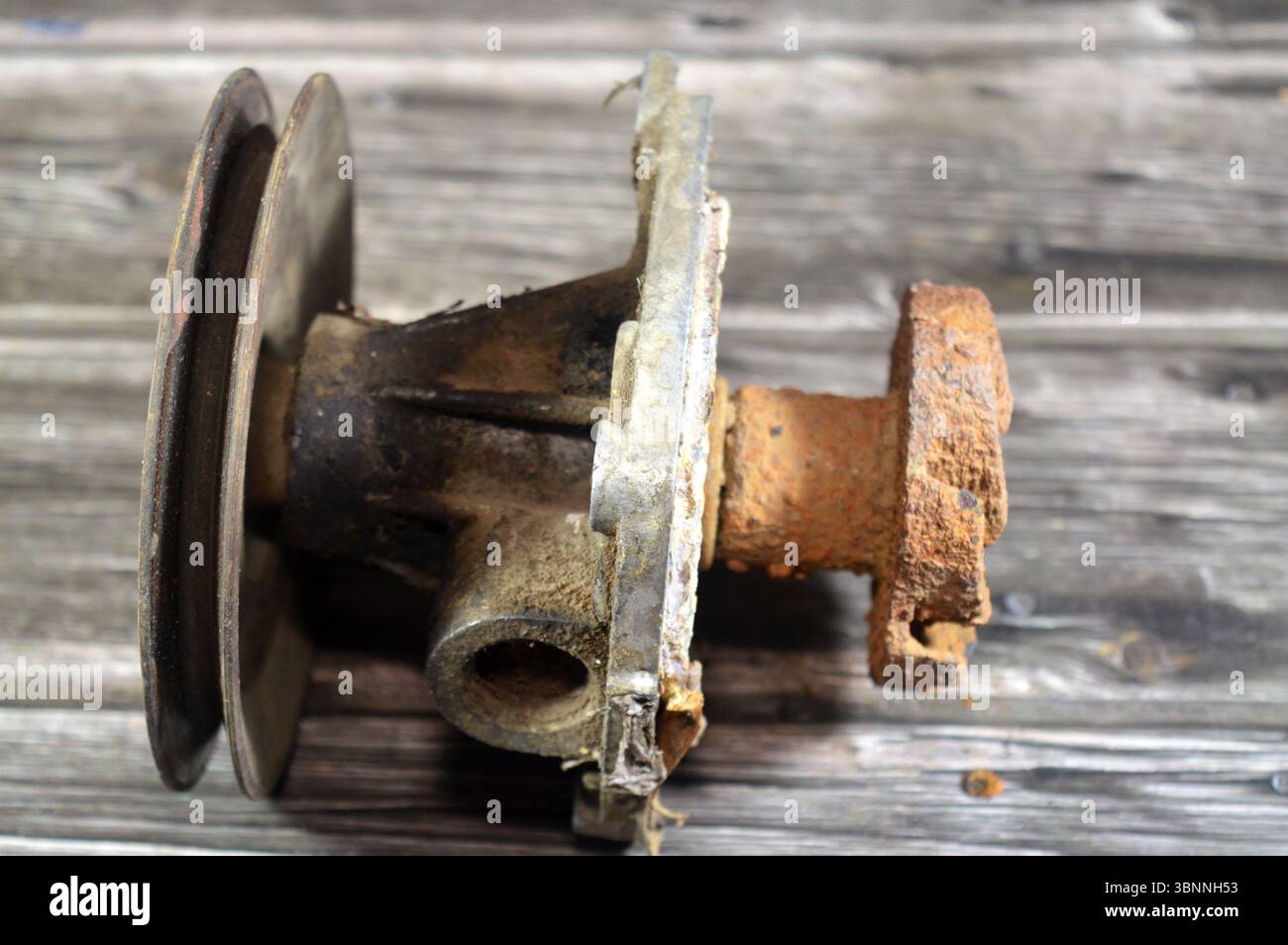 a used old rusty car water pump, water pump is vital to a car engine’s ...