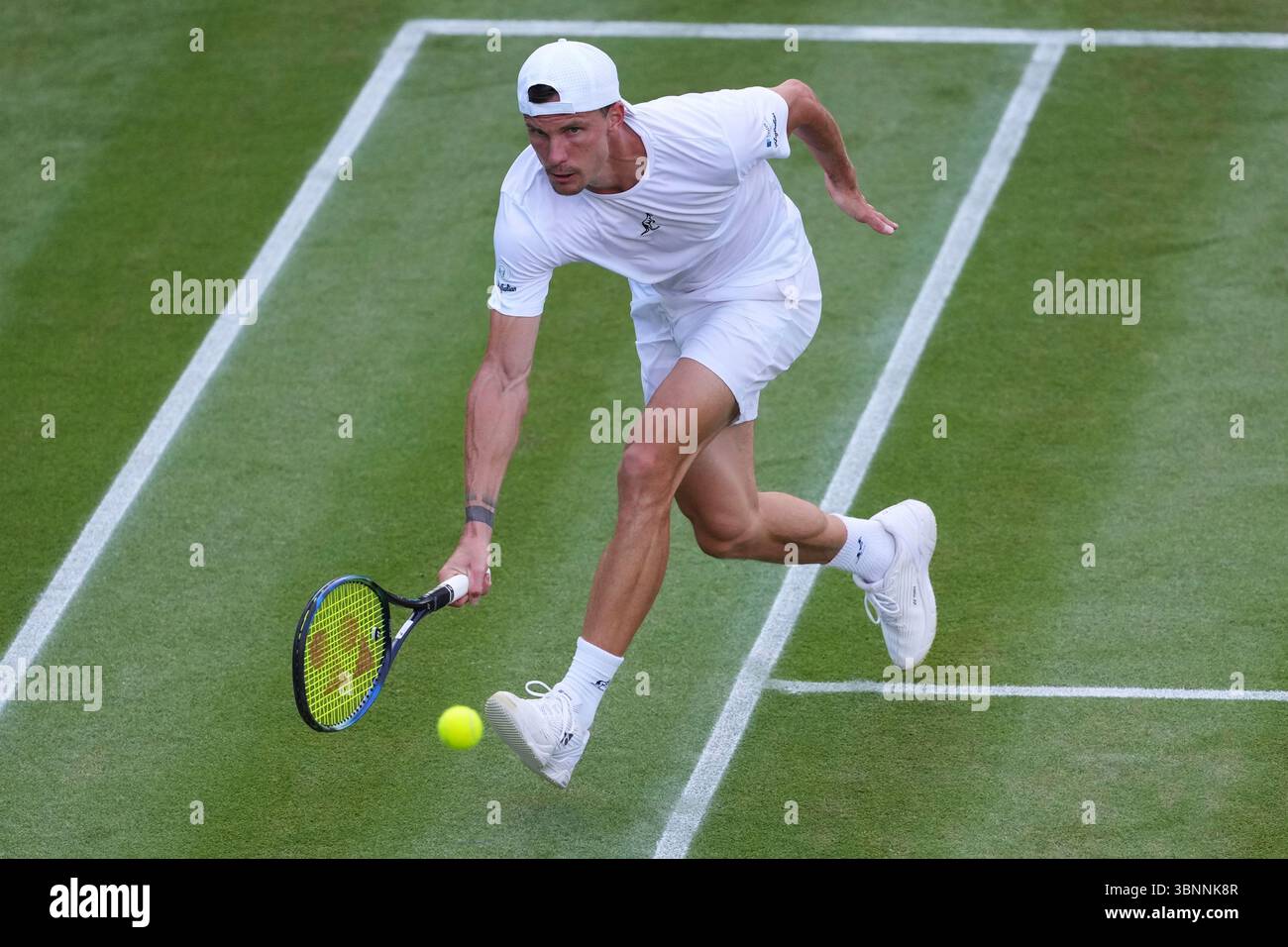 Marton Fucsovics of Italy plays a return to Gael Monfils of France in ...