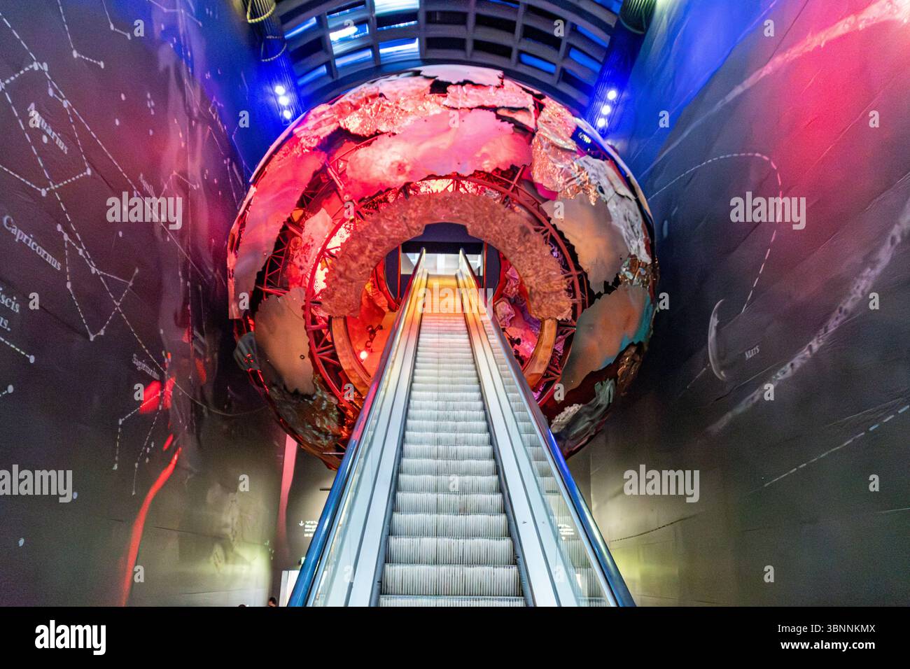 The Earth Hall with its red globe escalator displayed at the London ...