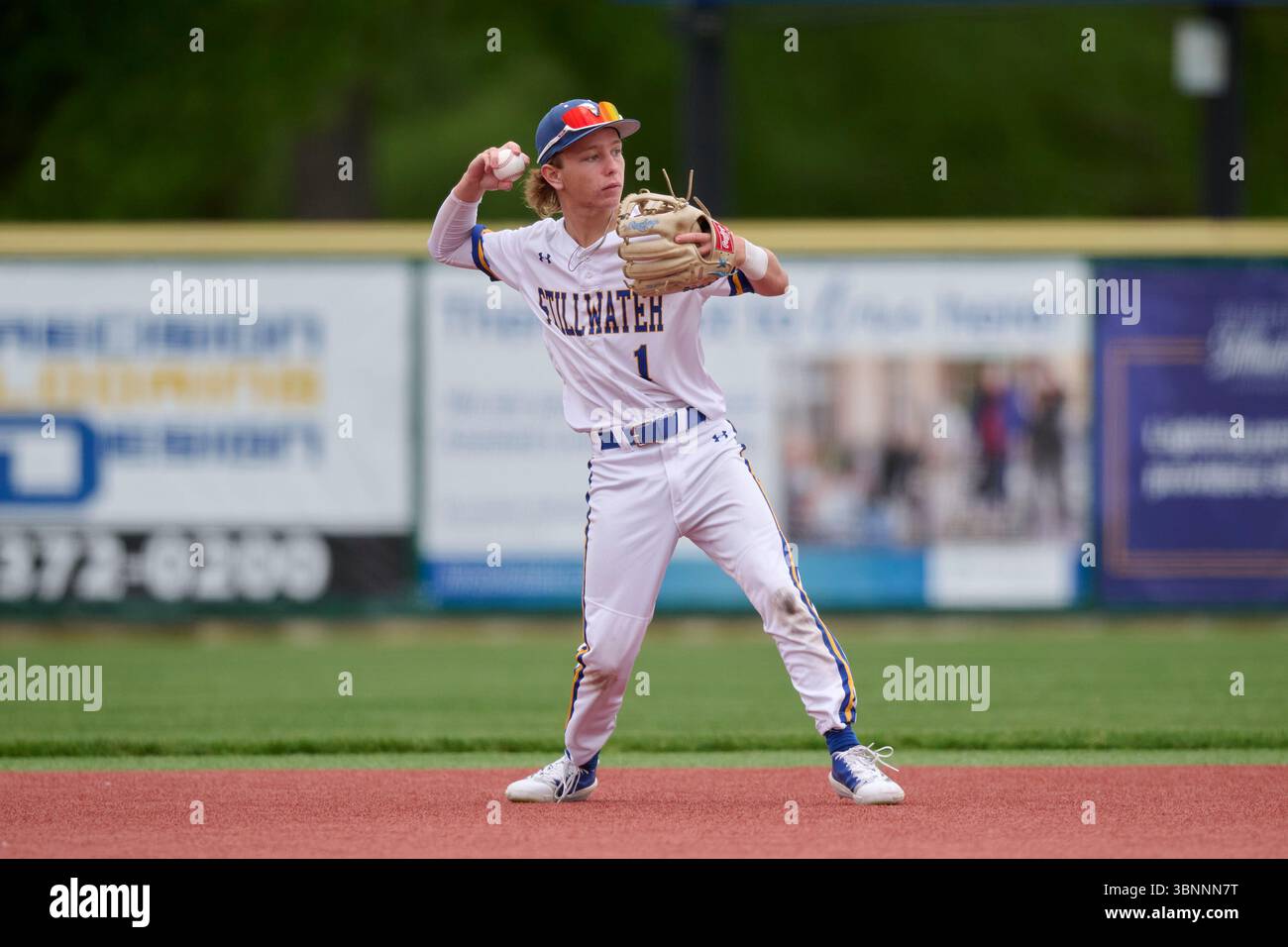 Stillwater Pioneers second baseman Brady Holliday (1) throws to first ...
