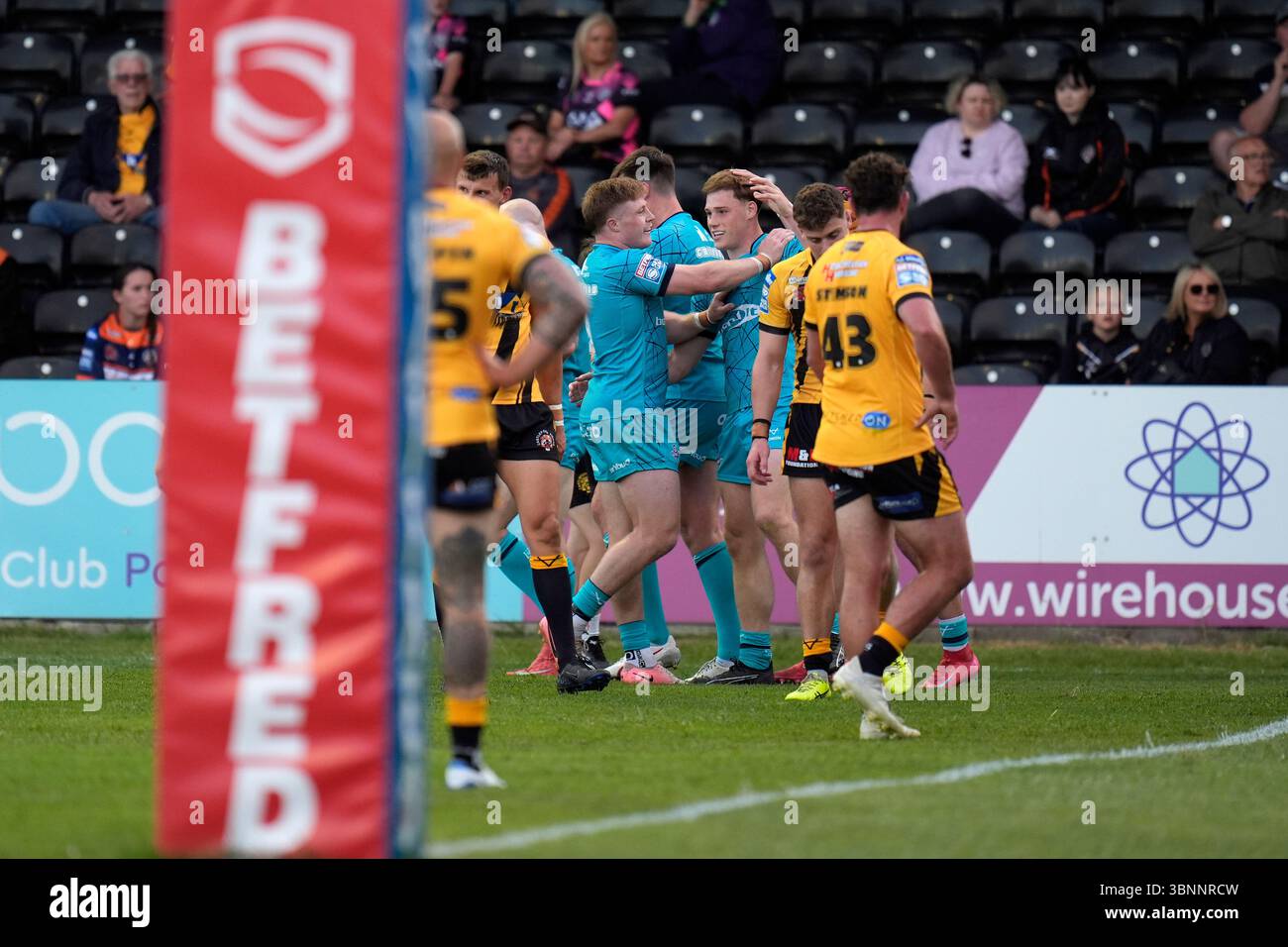 Huddersfield Giants' Sam Halsall (centre, facing) celebrates scoring ...