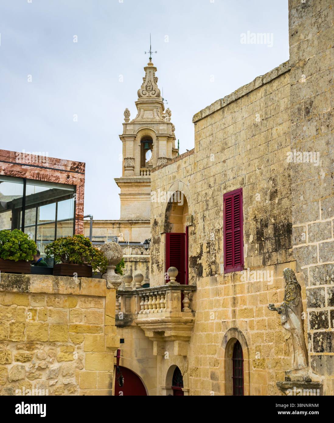 Panoramic view of bell tower of St. Paul's Cathedral in Mdina trough ...