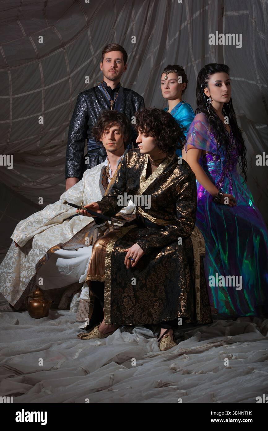 Oriental fantasy scene with Turkish-style dressed models in elaborate ...