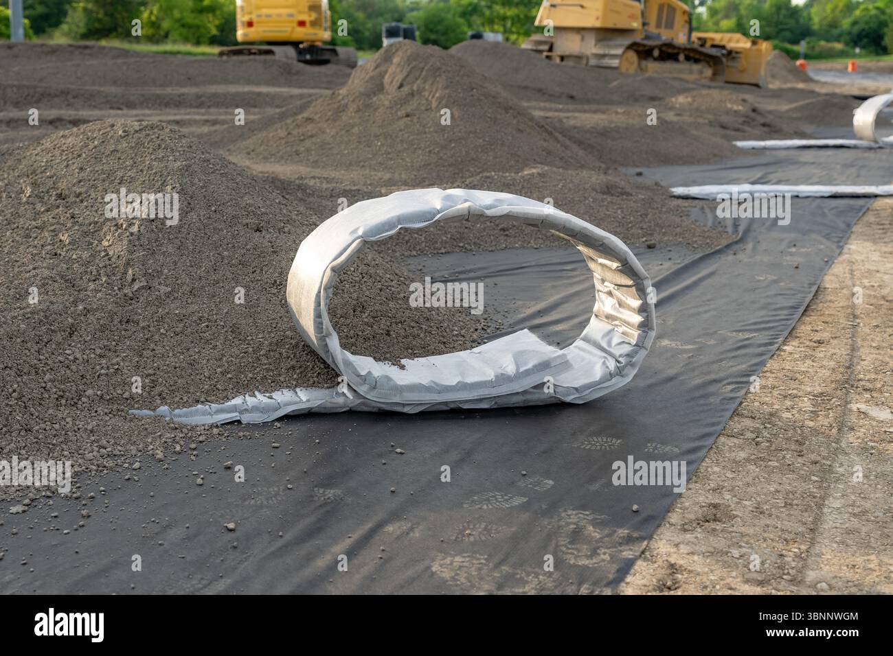 Construction photo of a roll of flat panel drainage pipe being ...