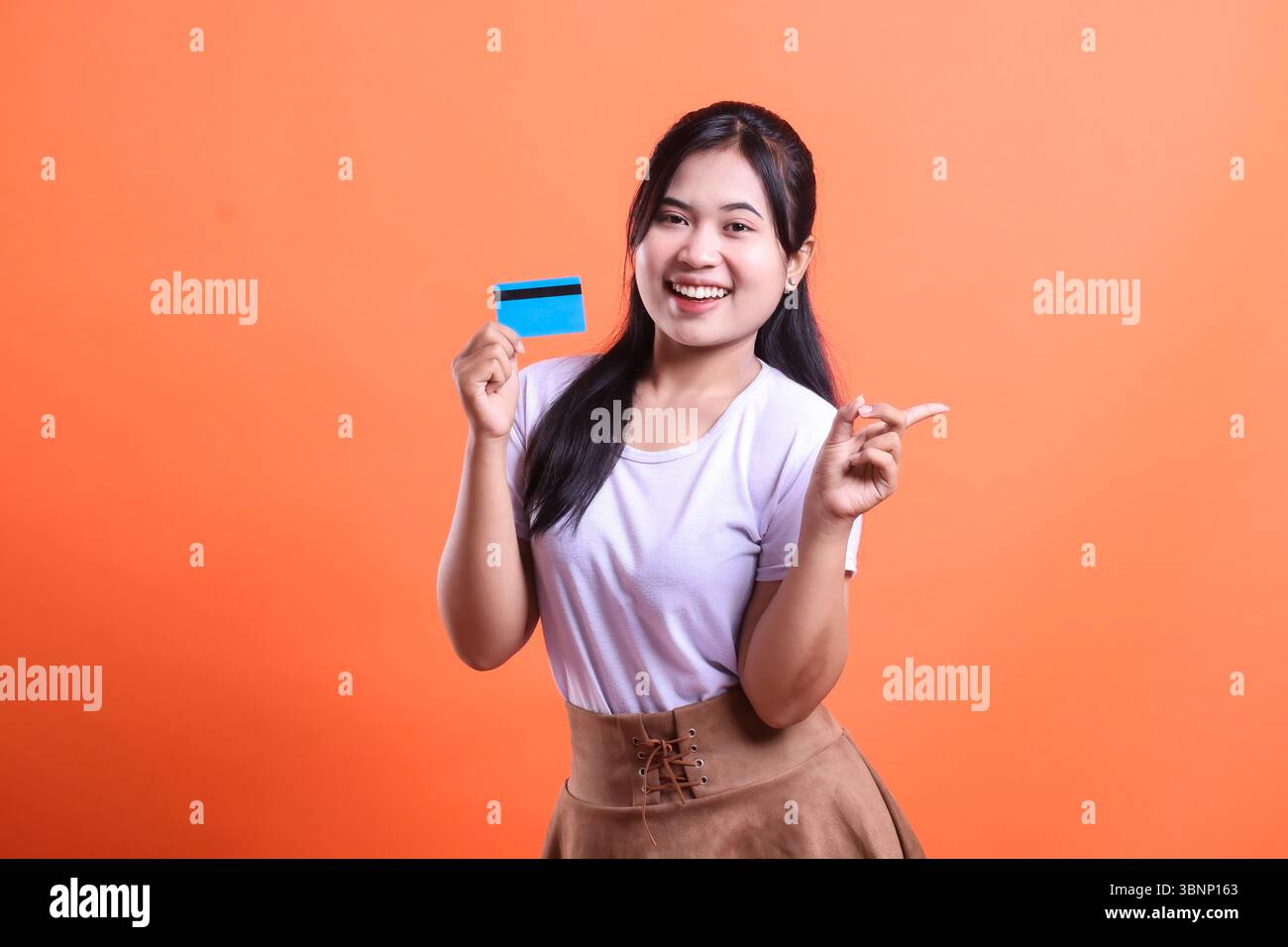 Cheerful young woman proudly displays hi-res stock photography and ...