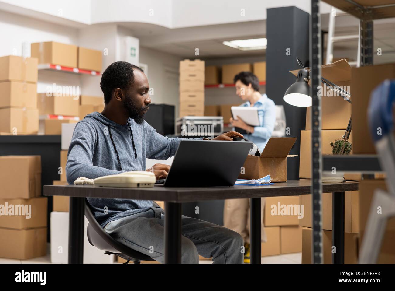 African american warehouse employee running local brand operations ...