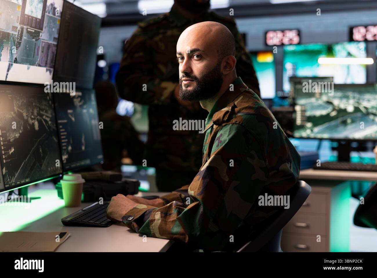 Intelligence corps agent working in command center housing operational ...