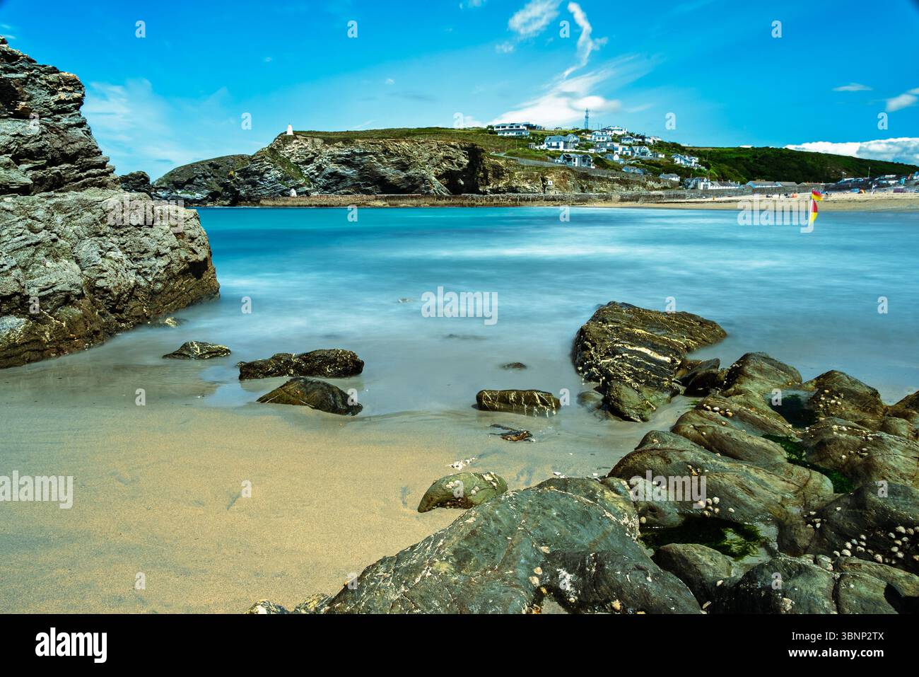 A long exposure photograph captures the serene beauty of a coastal ...
