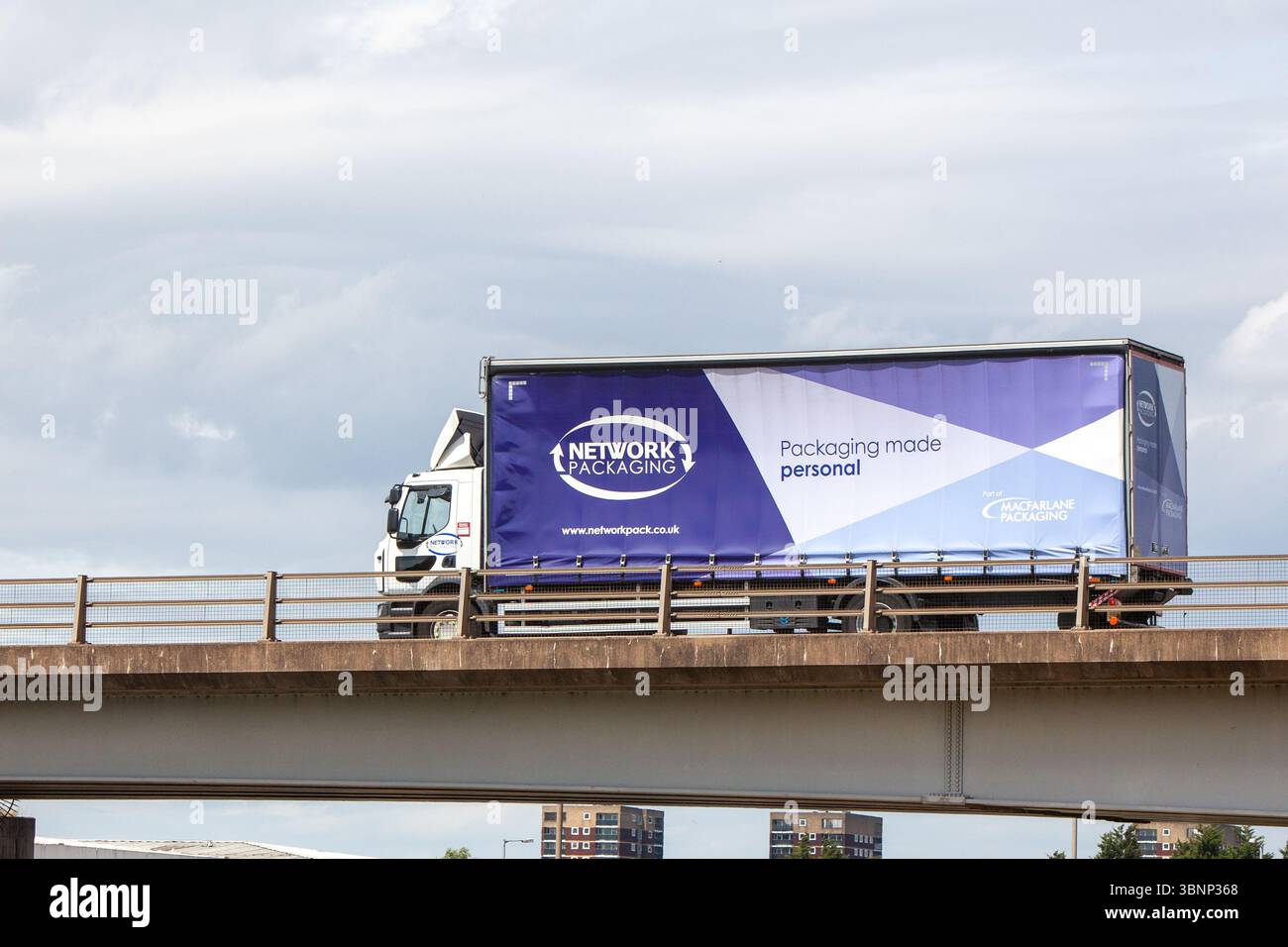 White DAF XF lorry with a blue and white curtain-sided trailer, branded ...