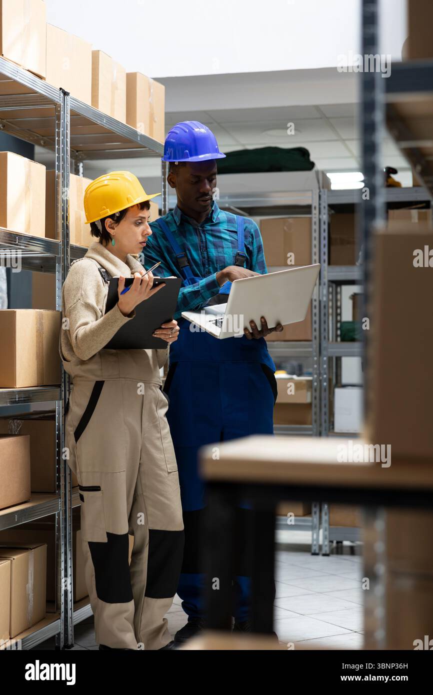 Diverse team employees scanning boxes hi-res stock photography and ...