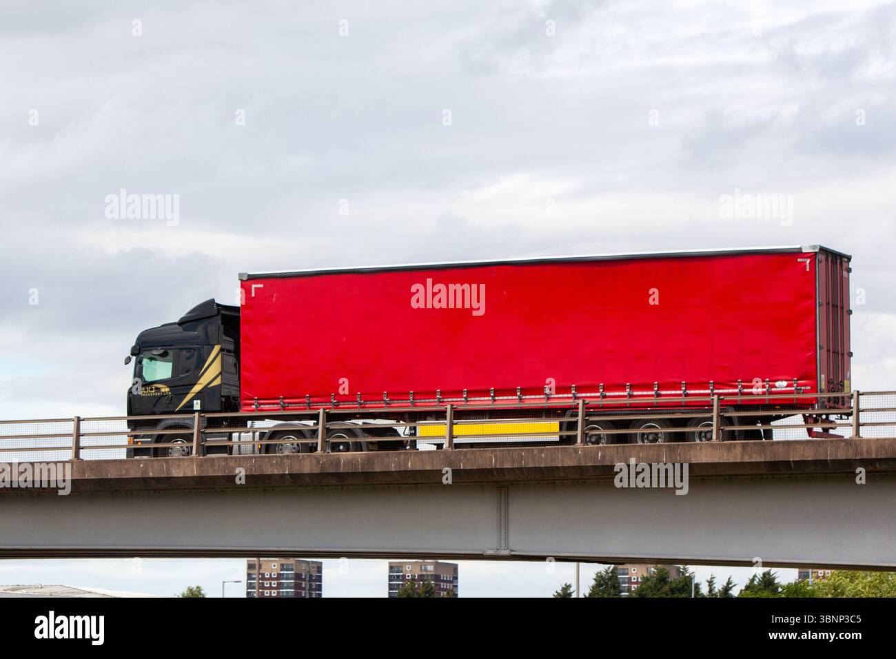 A.K.J Transport Black Scania articulated lorry with a plain red curtain ...
