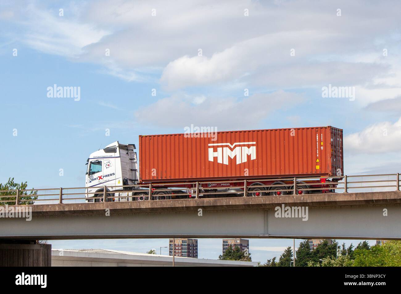 A Port Express articulated lorry transports an HMM multimodal container ...