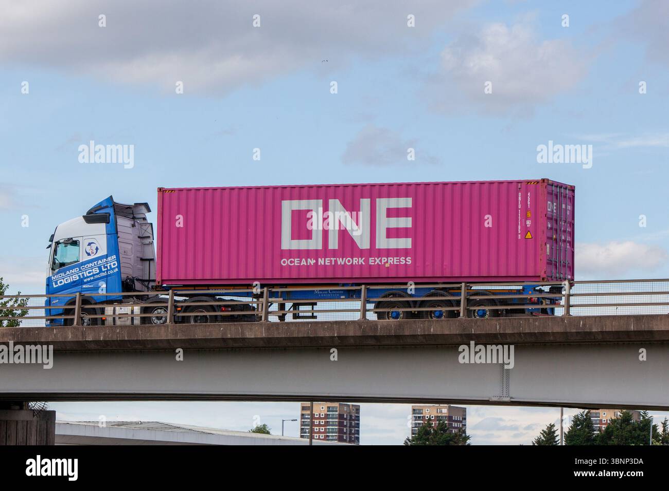 A Midlands Container Logistics articulated lorry with a bright pink ONE ...