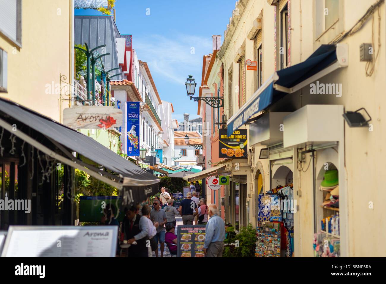 Vibrant pedestrian street in Cascais, showcasing local businesses ...
