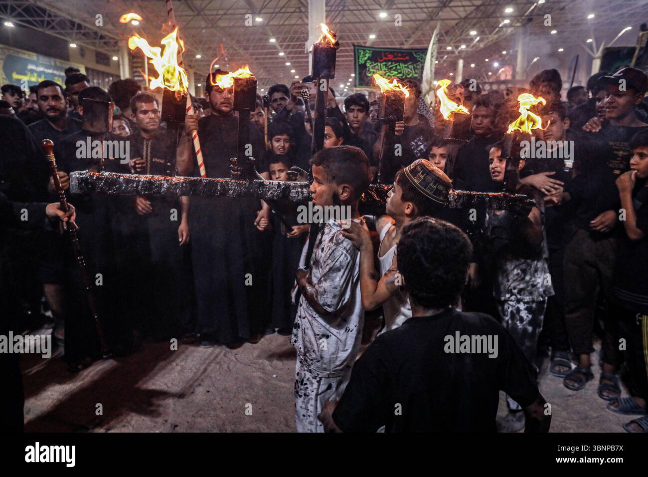 Najaf, Iraq. 03rd July, 2025. Shiite Muslims perform mourning rituals ...