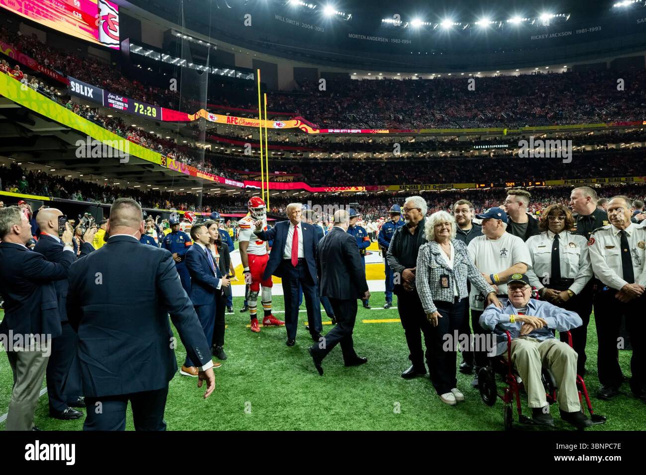 President Donald Trump greets players and first responders on the field ...