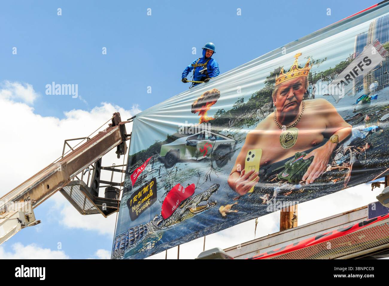 July 3, 2025, Phoenix, Arizona, USA: Workers install a politically ...