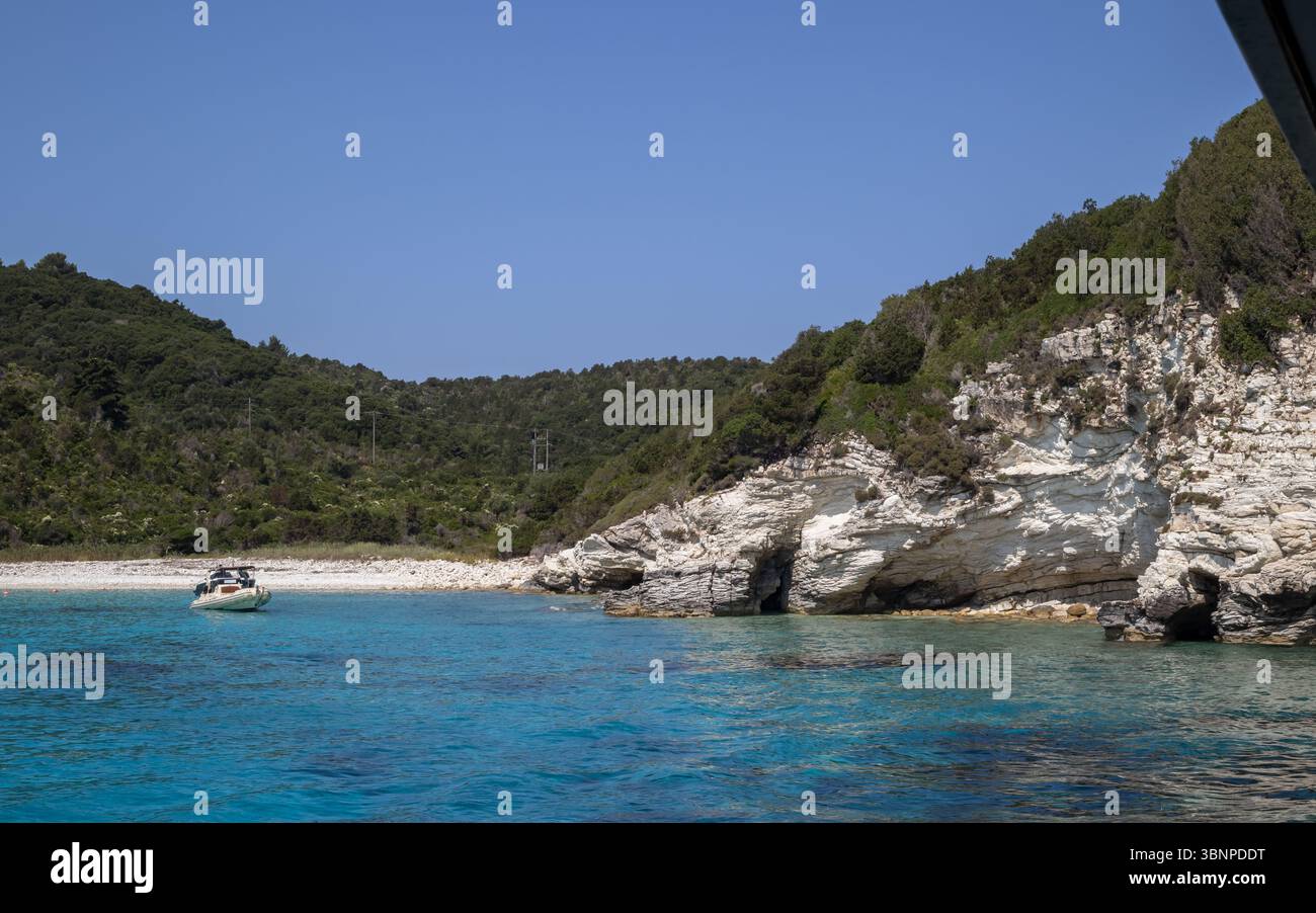 idyllic greek island cove with turquoise water and white cliffs Stock ...