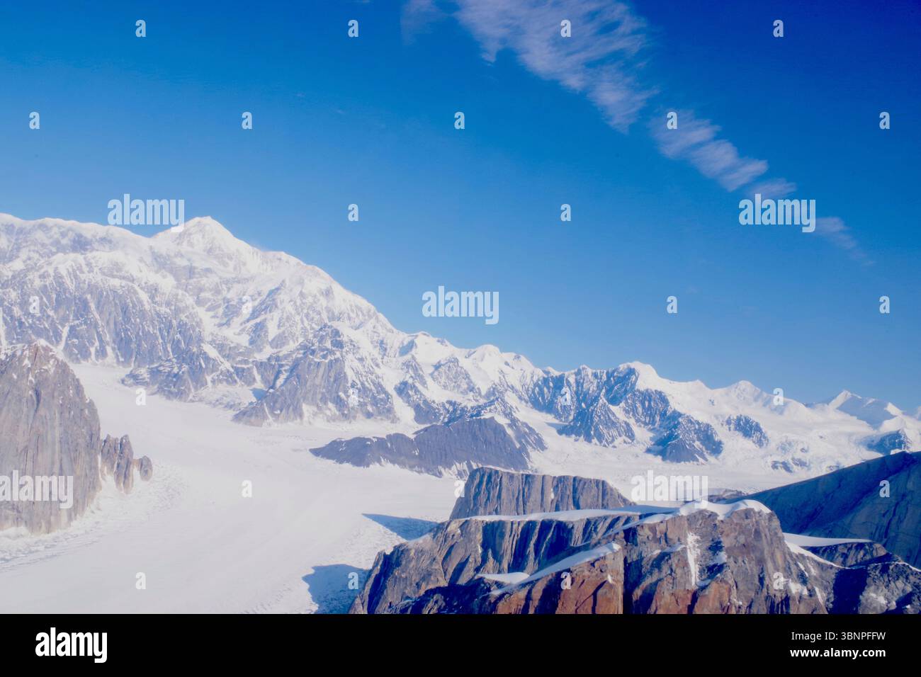 Aerial view of snow-covered Denali and surrounding glaciers on a clear ...