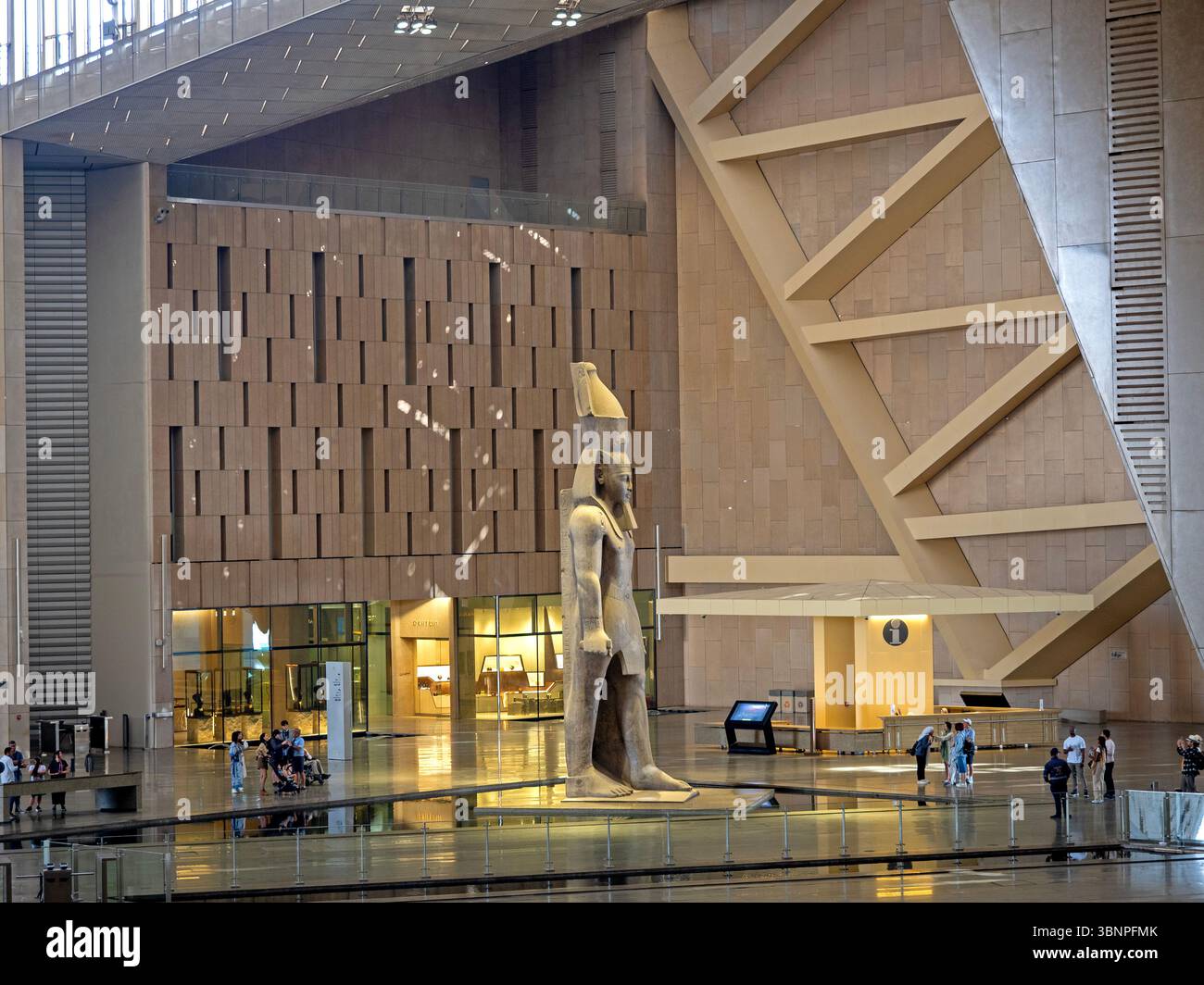 Statue of Ramesses II in the entrance hall of the Grand Egyptian Museum ...