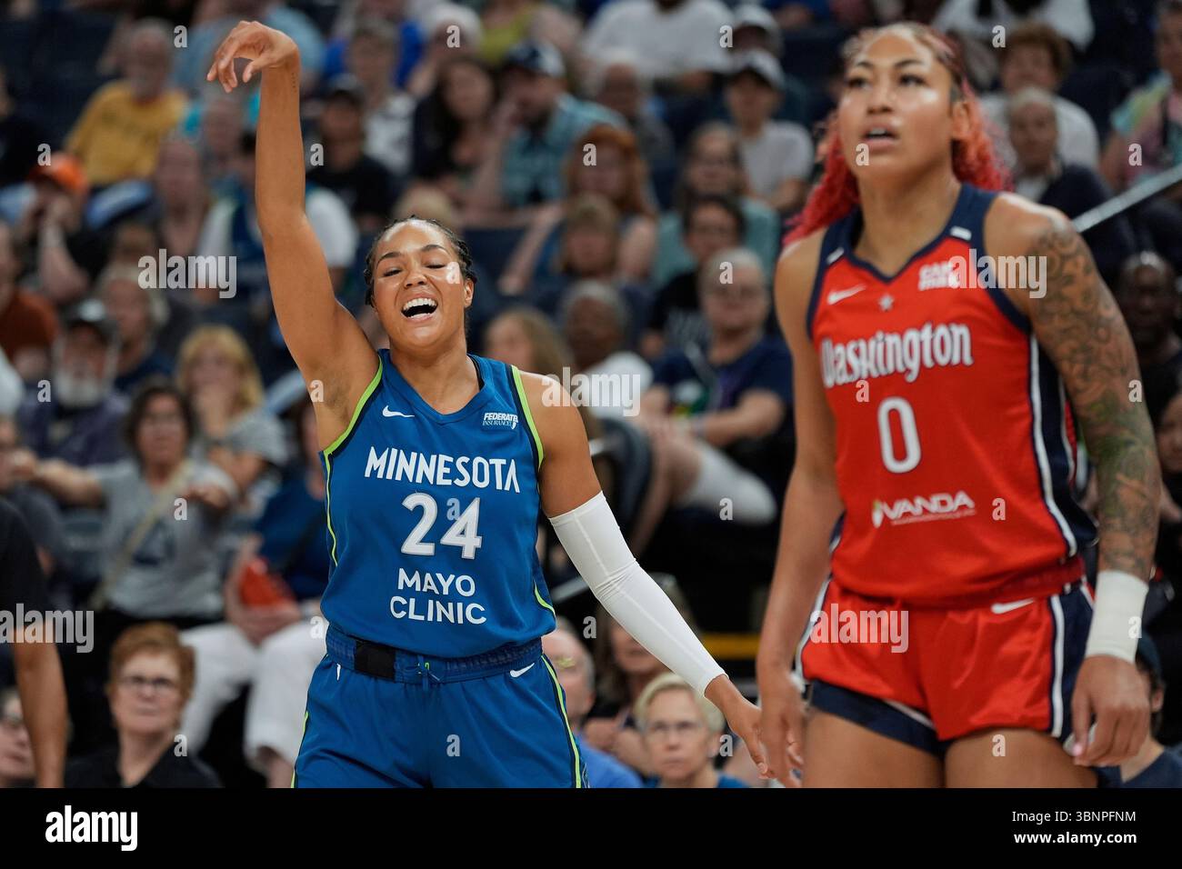 Minnesota Lynx forward Napheesa Collier (24) reacts next to Washington ...