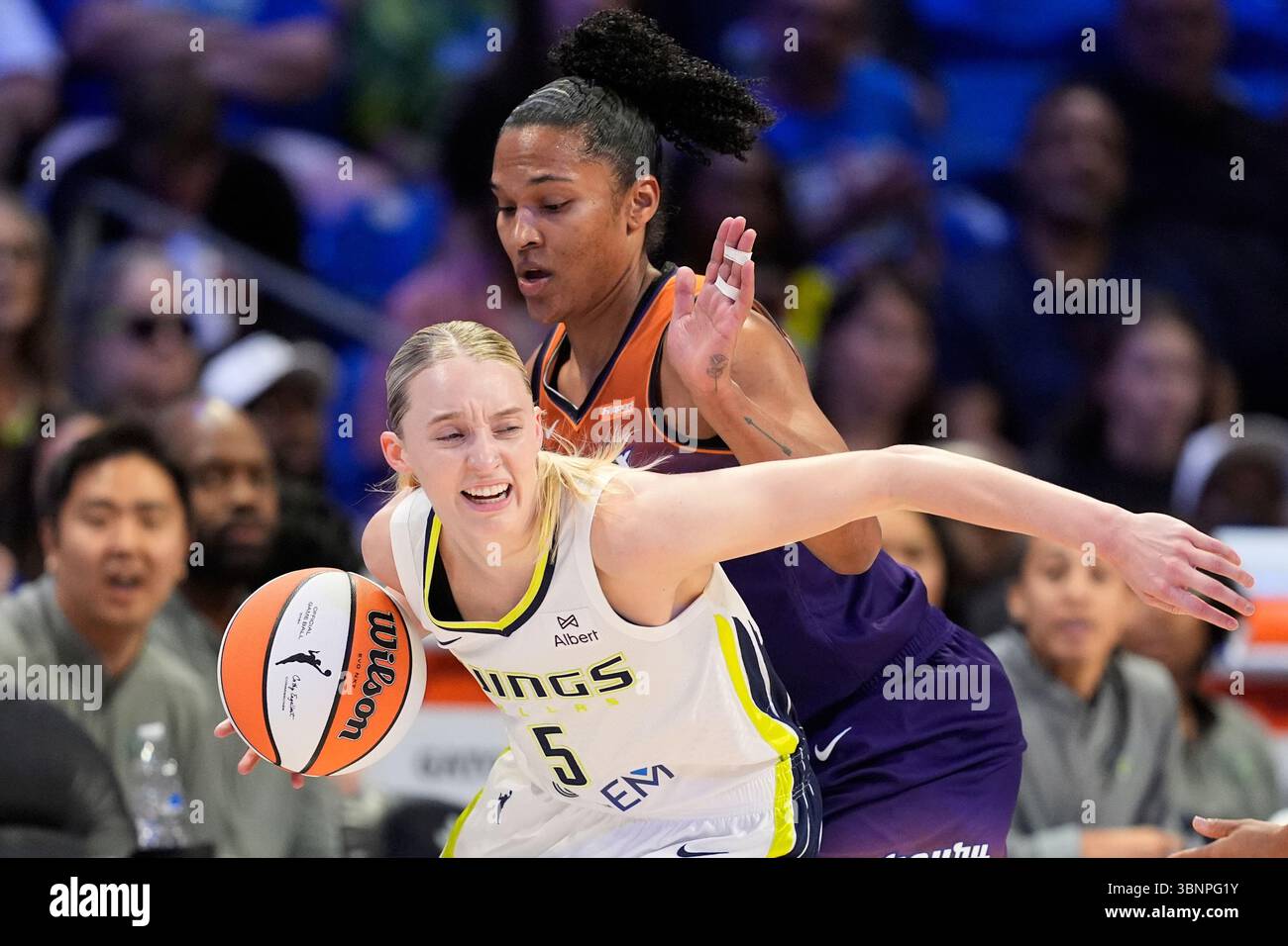 Dallas Wings' Paige Bueckers (5) controls the ball as Phoenix Mercury's ...