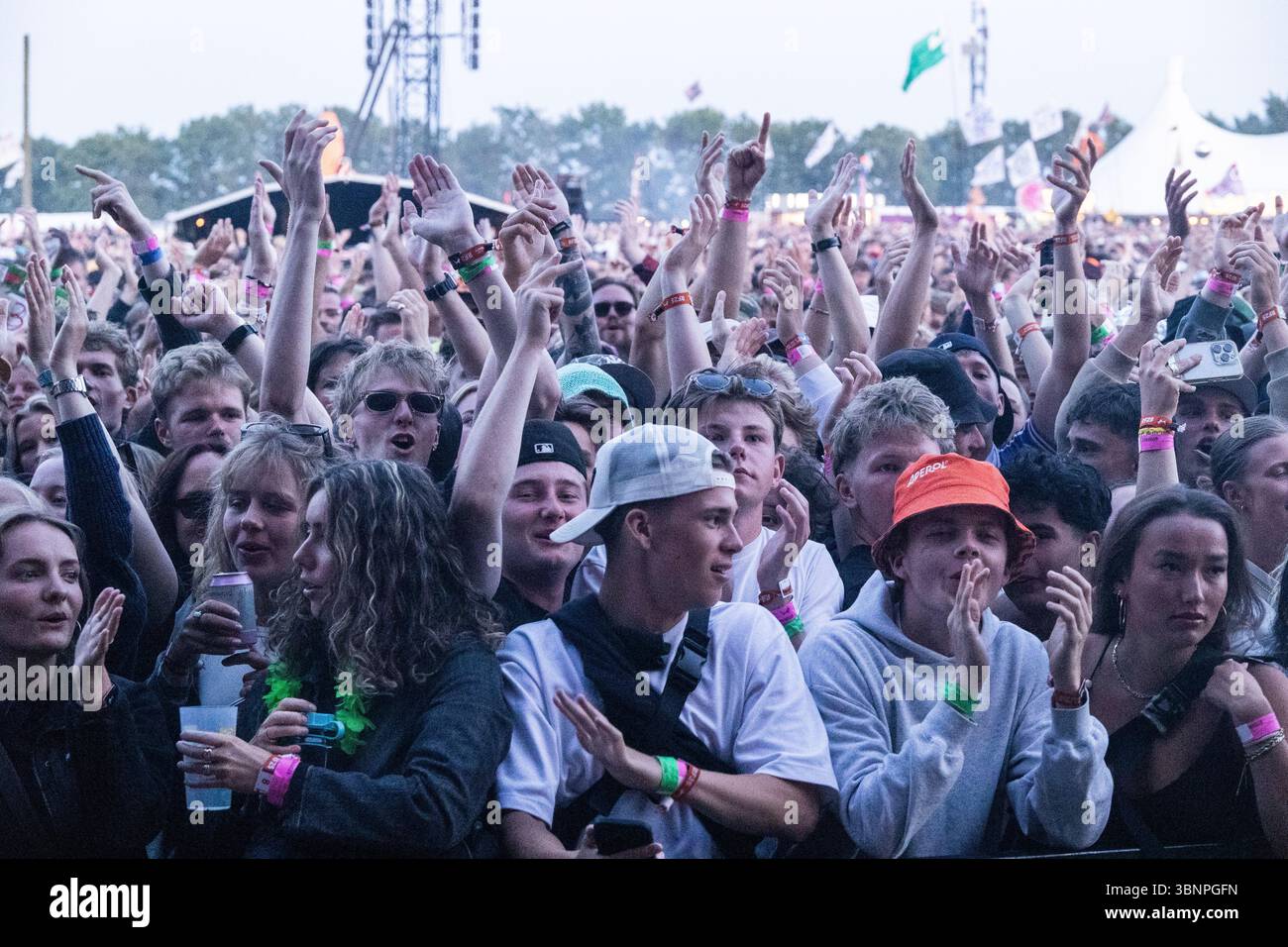 Festival goers enjoys a performance on the Orange Stage by the English ...
