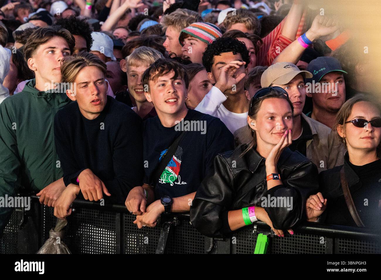 Festival goers enjoys a performance on the Orange Stage by the English ...