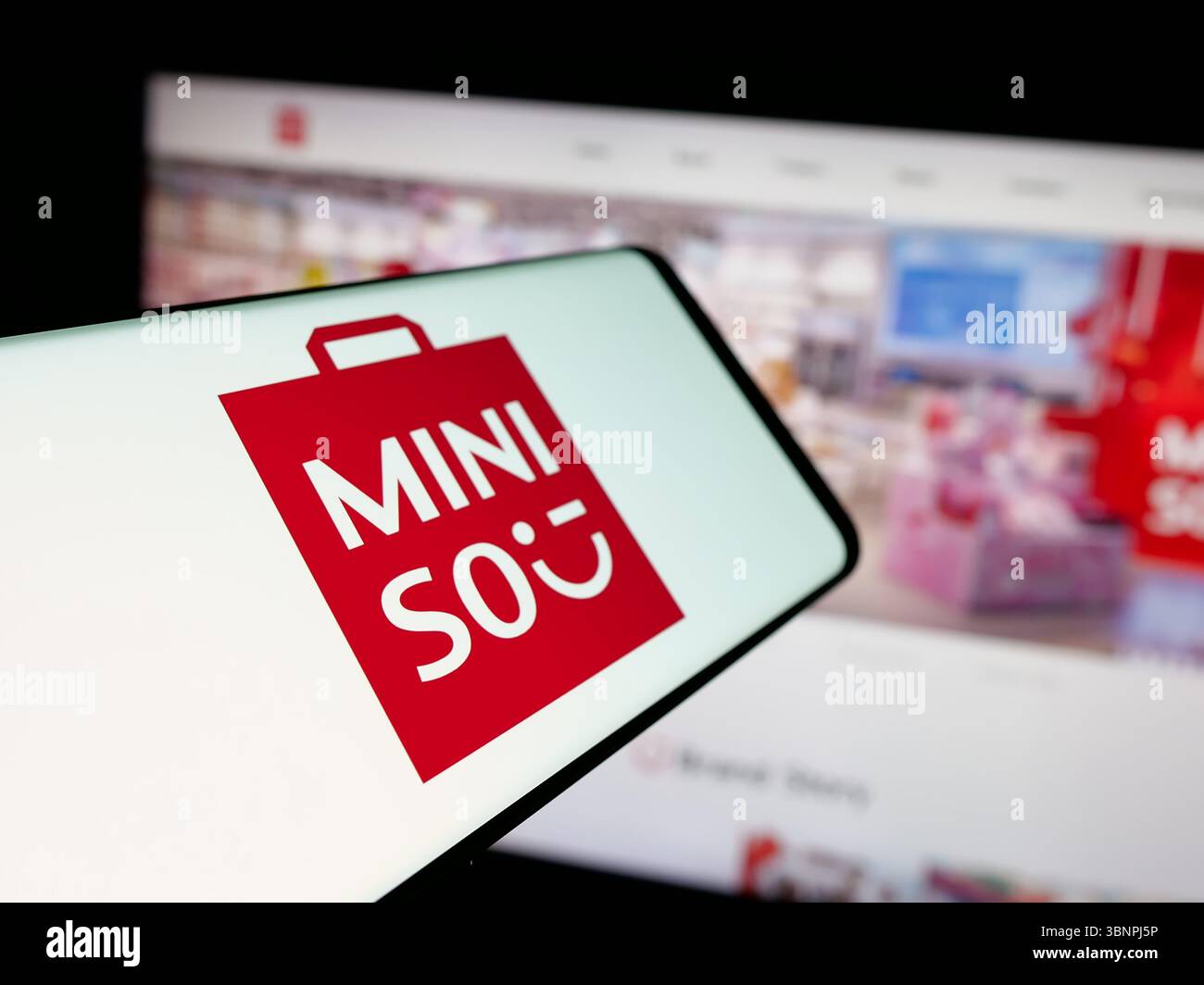 In this photo illustration, a smartphone with the logo of retail ...