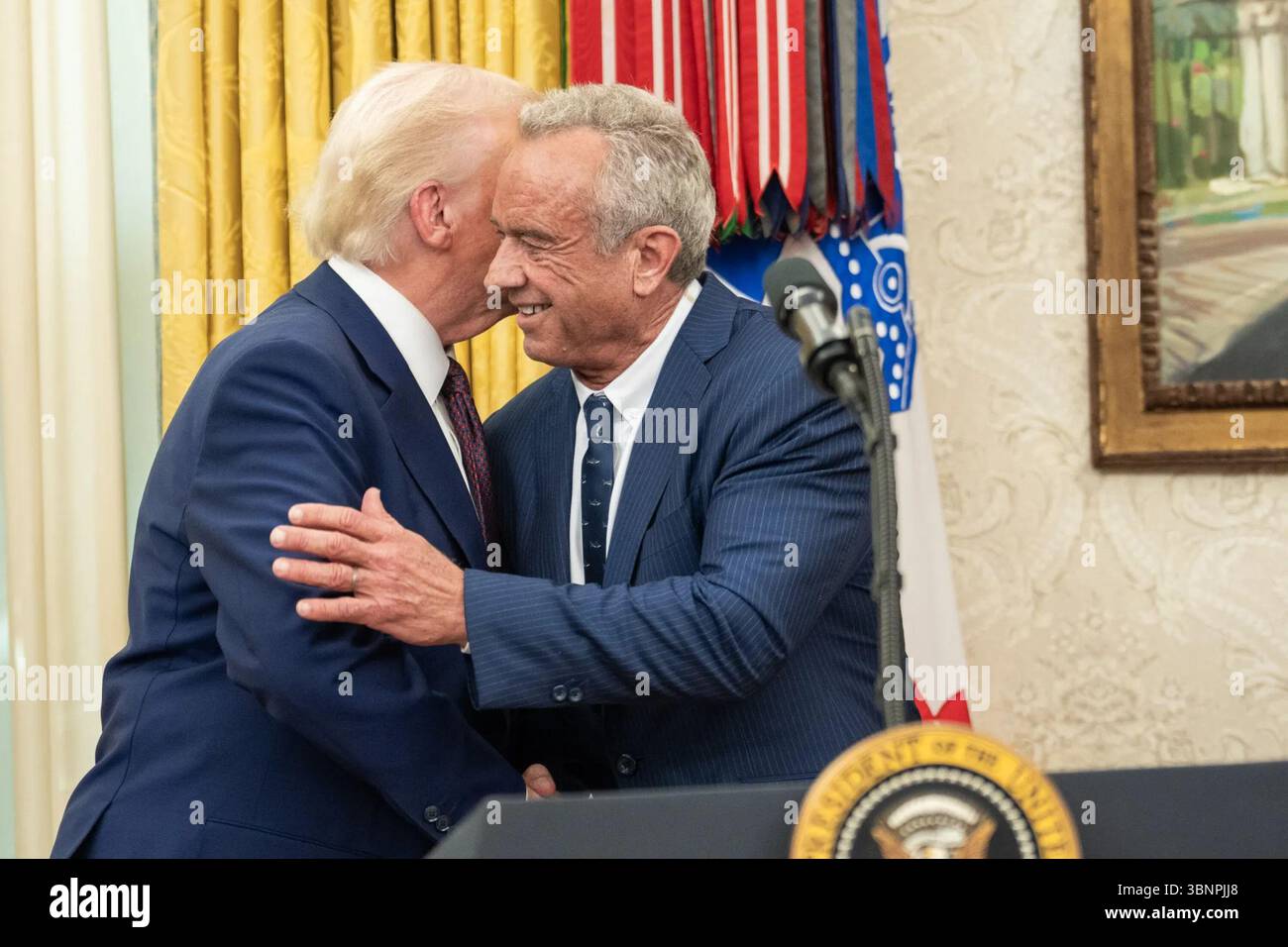 President Donald Trump congratulates Robert F. Kennedy Jr. following ...