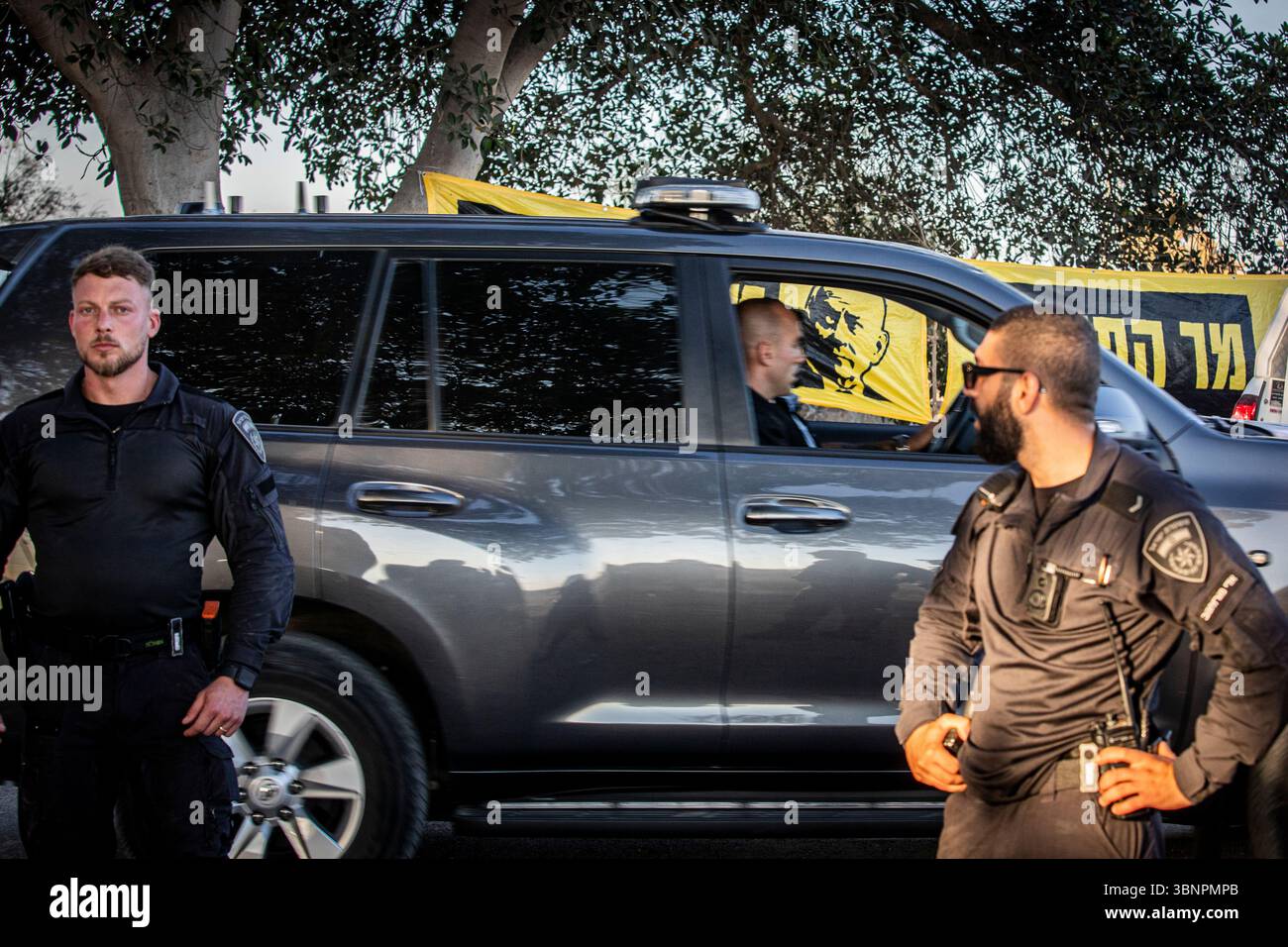Israeli police officers stand guard as the convoy of Israeli Prime ...